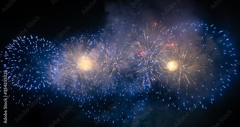 Bright, Blue and Gold Fireworks in the Night Sky (Celebration / Holiday ...