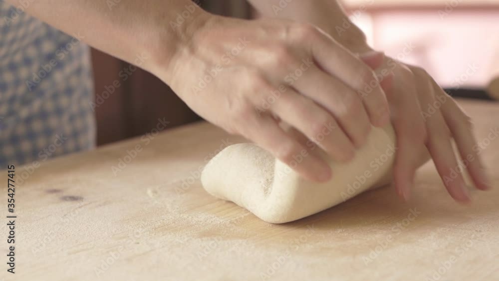 Making homemade fresh pasta: slow motion close up of woman hands ...
