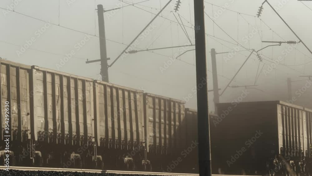 Freight train with carrier wagons row moving, railway heavy cargo ...