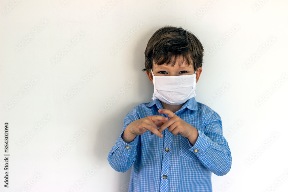 Caucasian boys wear white mask protection for protect virus or bacteria ...