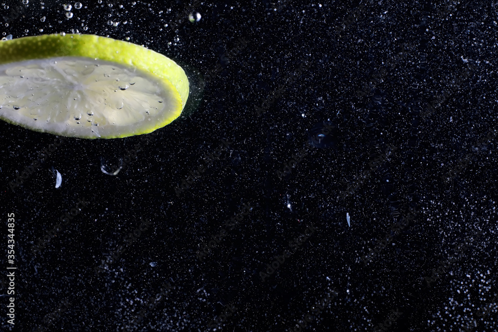 Water drops on ripe sweet lemon. Fresh lime background with copy space ...