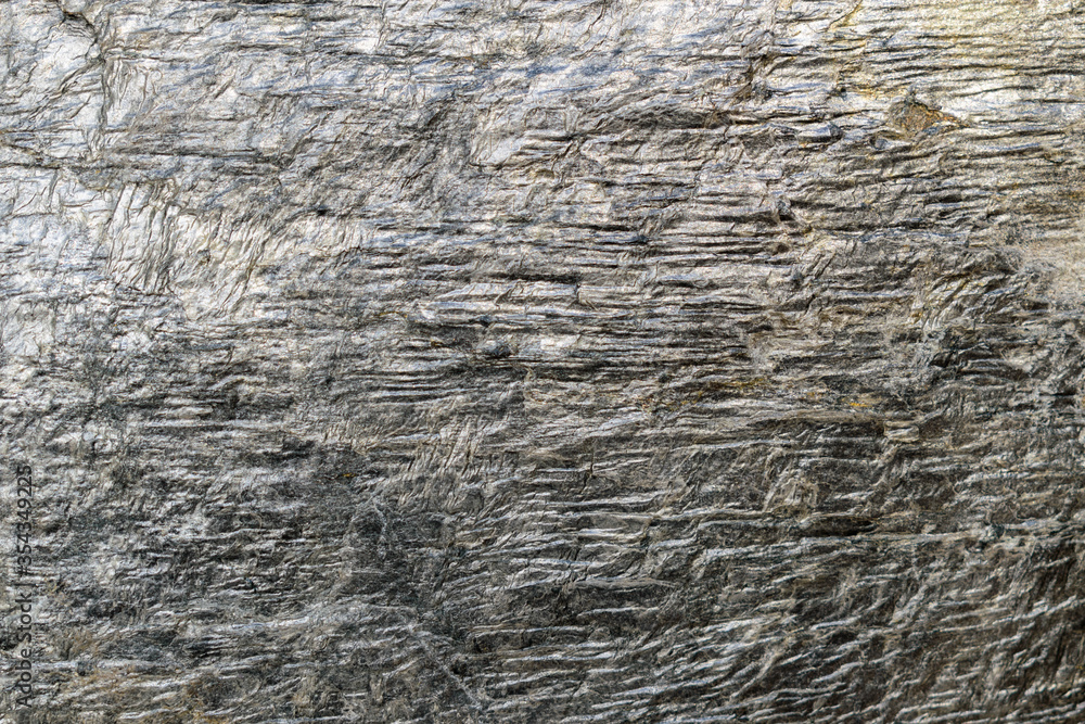 Gold-antimony ore for backdrop. Stibnite with gilded veins. Close-up ...