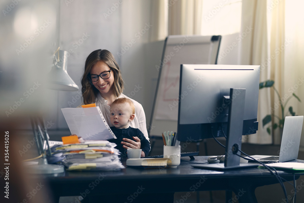 Portrait of a professional and beautiful young business woman and mom ...