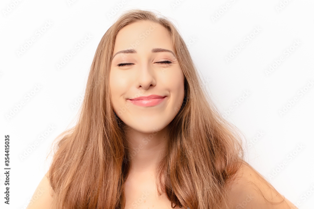 young pretty woman with a goofy, crazy, surprised expression, puffing ...