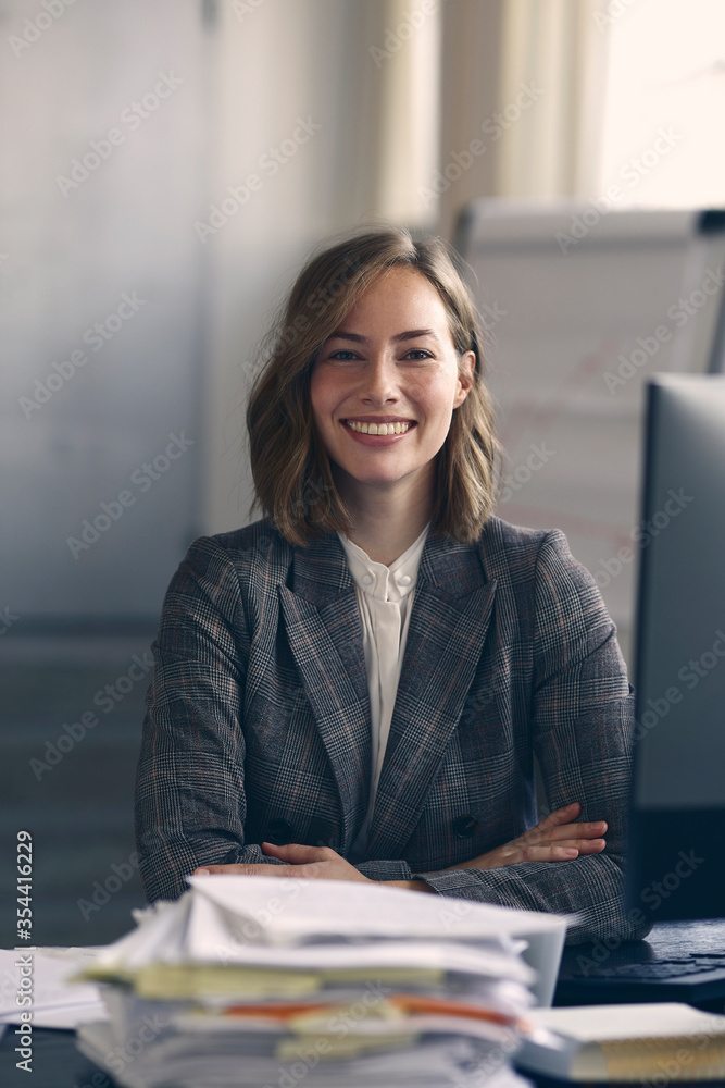 Business portrait of smiling beautiful female CEO wearing a suit ...