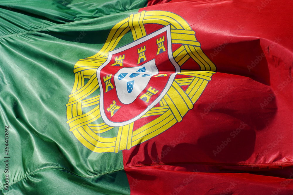 Bandeira de Portugal ao vento Stock Photo | Adobe Stock