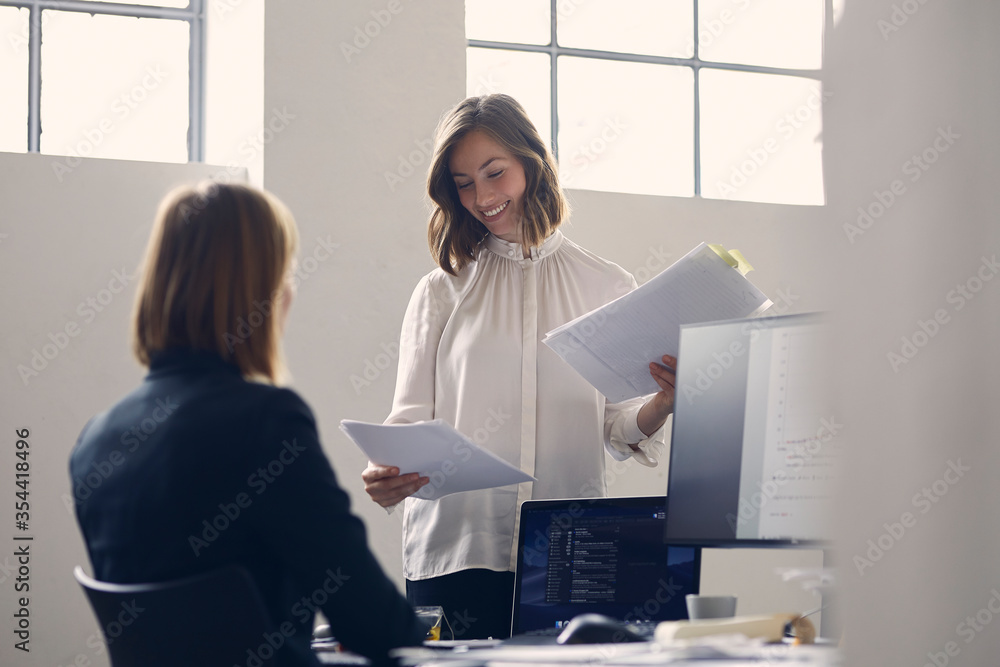 Beautiful young and professional businesswoman getting nice respons on ...