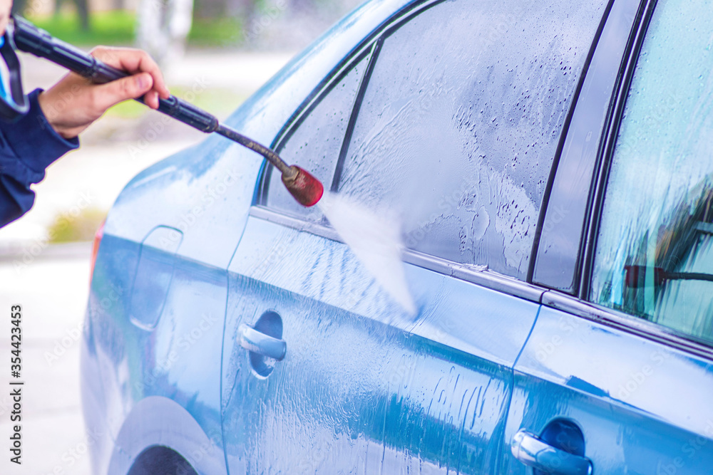 Manual car wash with pressurized water in car wash outside.Cleaning Car ...