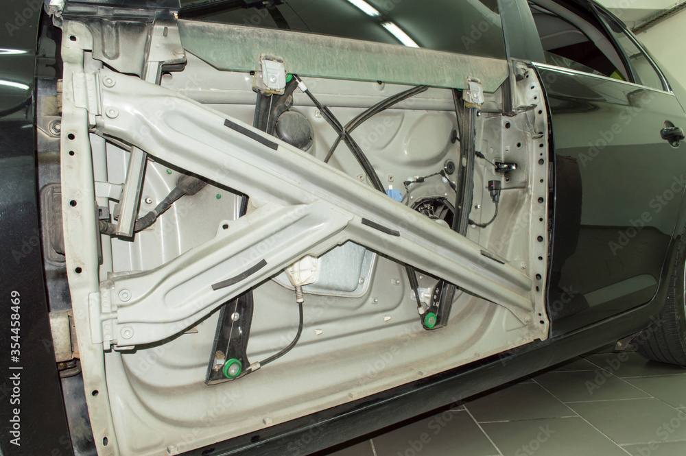 Mechanism of the electric window lifter installed on the car Stock ...