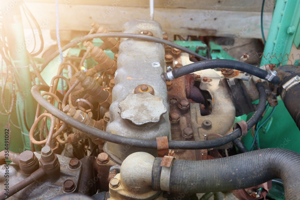 Close-up of an old used diesel engine with rusty and dirty car parts ...