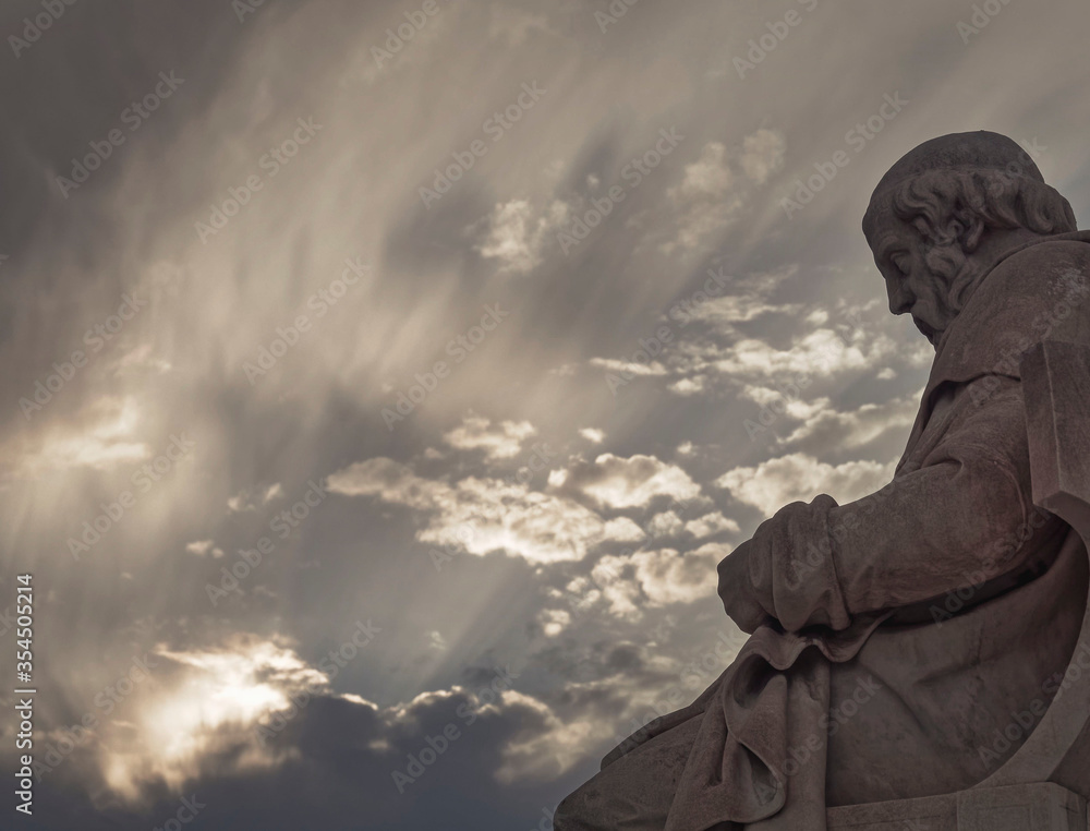Plato tstue the ancient Greek philosopher, under impressive cloudy sky ...