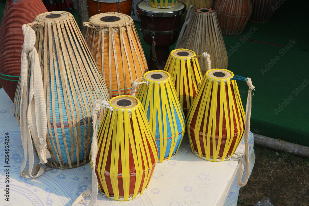 Multi-colored Indian drums. Drums of different sizes and colors are on ...
