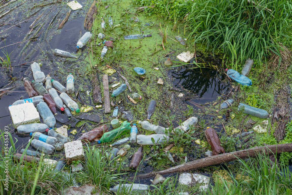 Water pollution. Plastic trash floats in the river. Stock Photo | Adobe ...