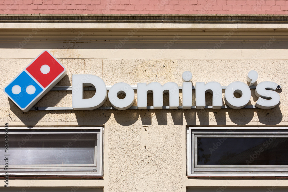 Stade, Germany - May 28, 2020: Signage outside a Dominos Pizza outlet ...