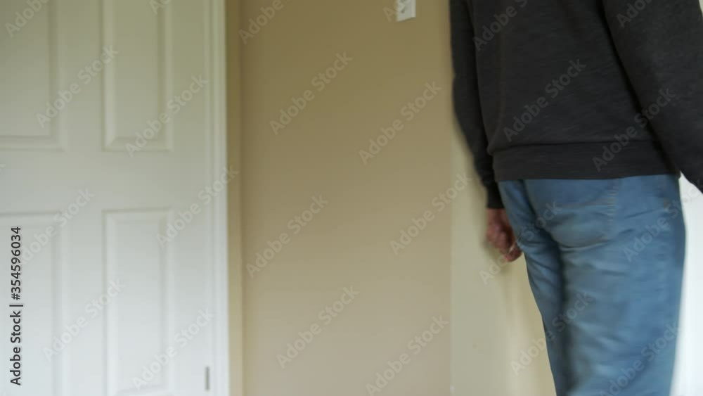 High quality slow motion close-up 4k video of a young man walking into ...