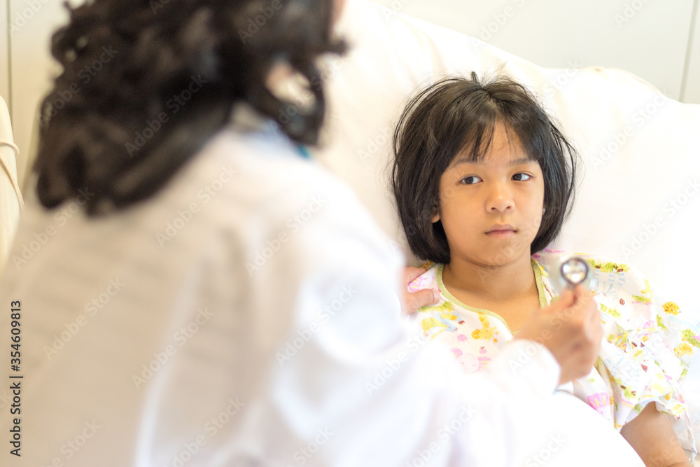 Asian sick kid patient or child inpatient on hospital bed with ...