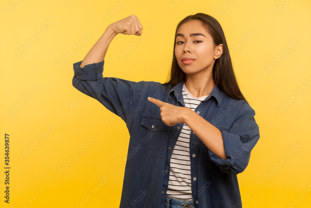 Look, I am strong! Portrait of confident proud girl in denim shirt ...