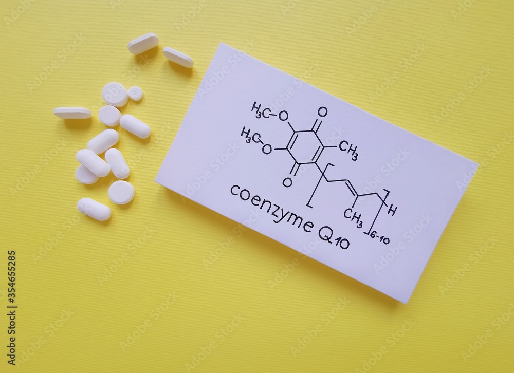 Structural chemical formula of Coenzyme Q10 molecule with tablets and ...