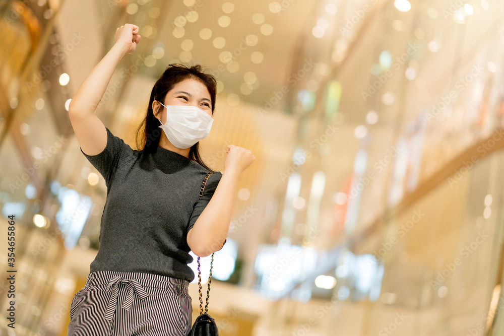 new normal after covid epidemic young asian female glad and hand rise ...