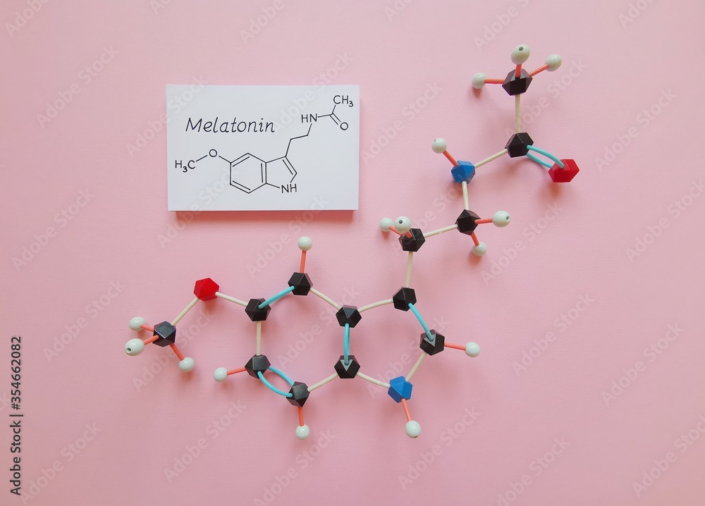 Molecular structure model and structural chemical formula of melatonin molecule. Melatonin is a ...