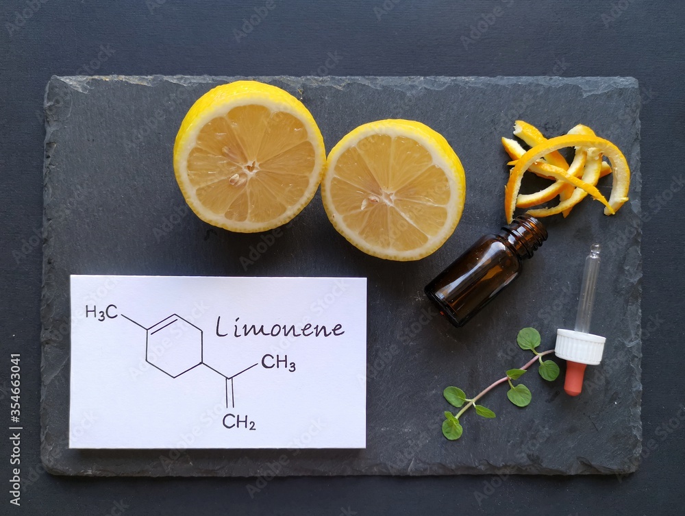 Structural chemical formula of limonene with fresh citrus fruit and a ...