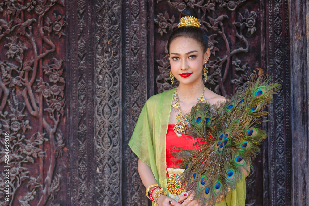 Luxury portrait of a beautiful Thai girl in traditional thai red ...