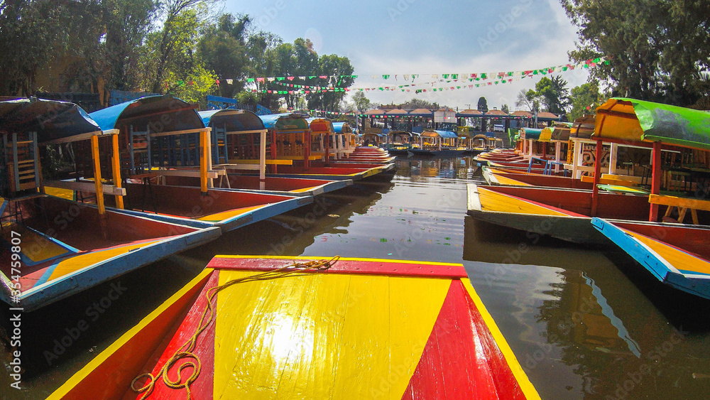 Traditional Mexican trajinera boat in the Xochimilco channels in Mexico ...