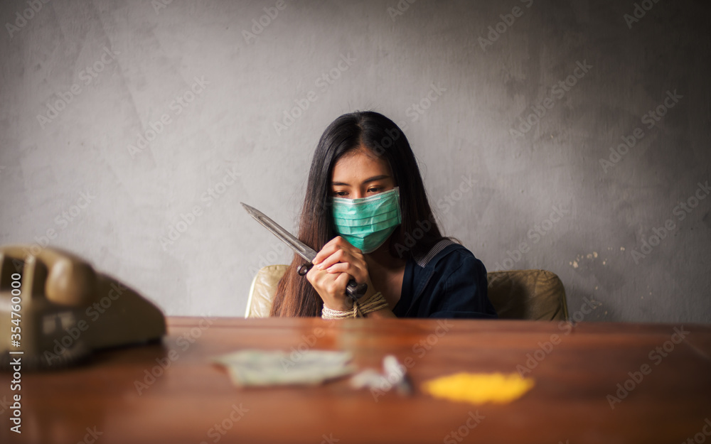 knife in the hands of a cruel man, intimidating and imprisoning a woman ...