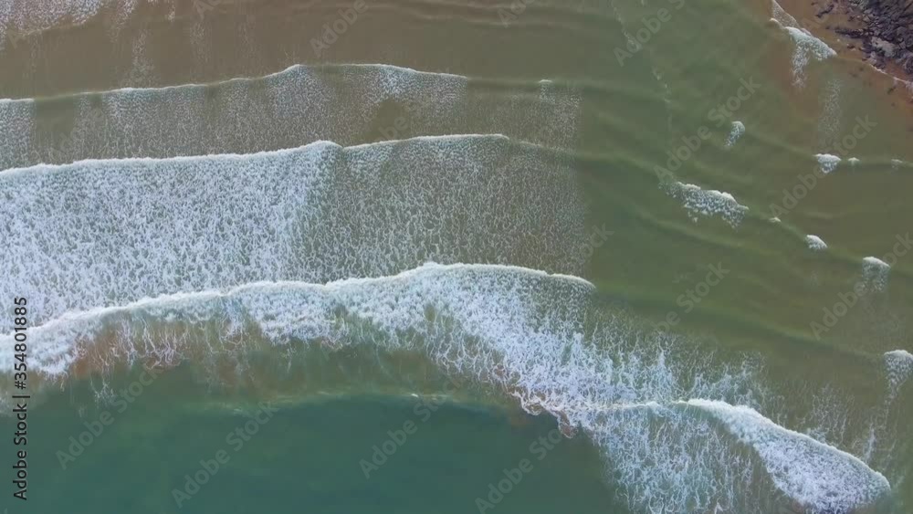 The beautiful pattern of the waves leading into an estuary on the ...