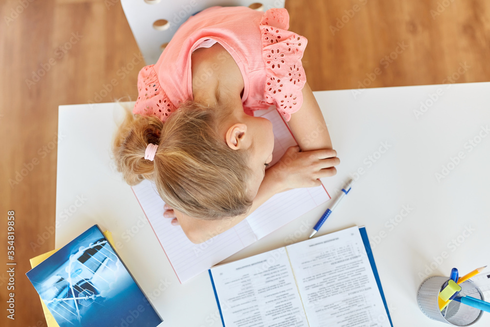 children, education and learning concept - tired student girl sleeping ...