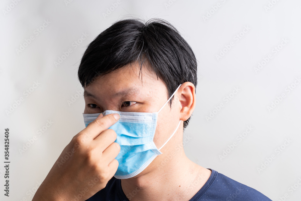 Man wearing facial hygienic mask. white background Virus protection ...