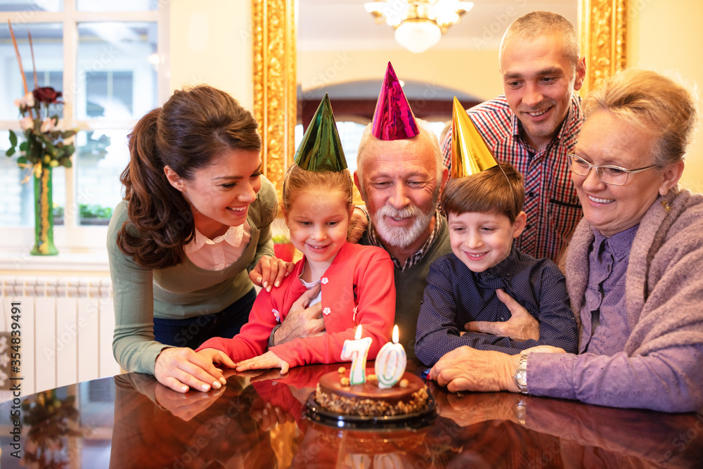 Family of all generations celebrating a birthday Stock Photo | Adobe Stock