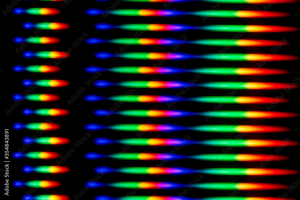 Photo of a diffraction pattern from a line of LEDs. Image was obtained ...