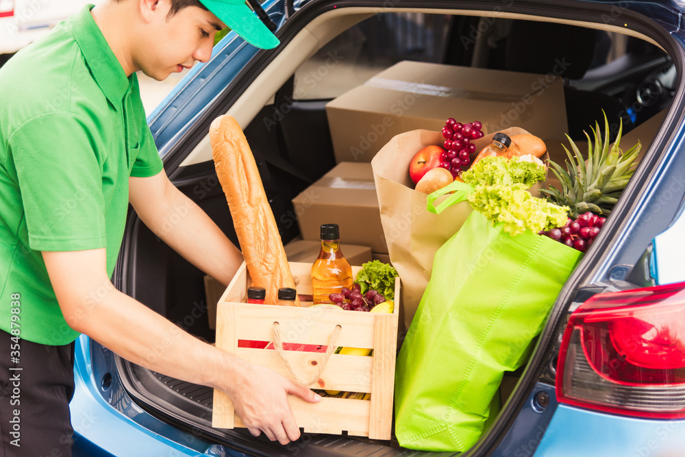 Asian delivery man grocery prepare service giving fresh vegetables food ...