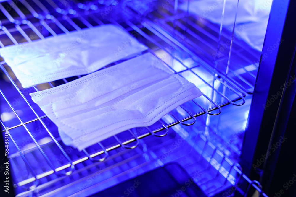 UV light sterilization of face mask to disinfection. COVID-19 ...