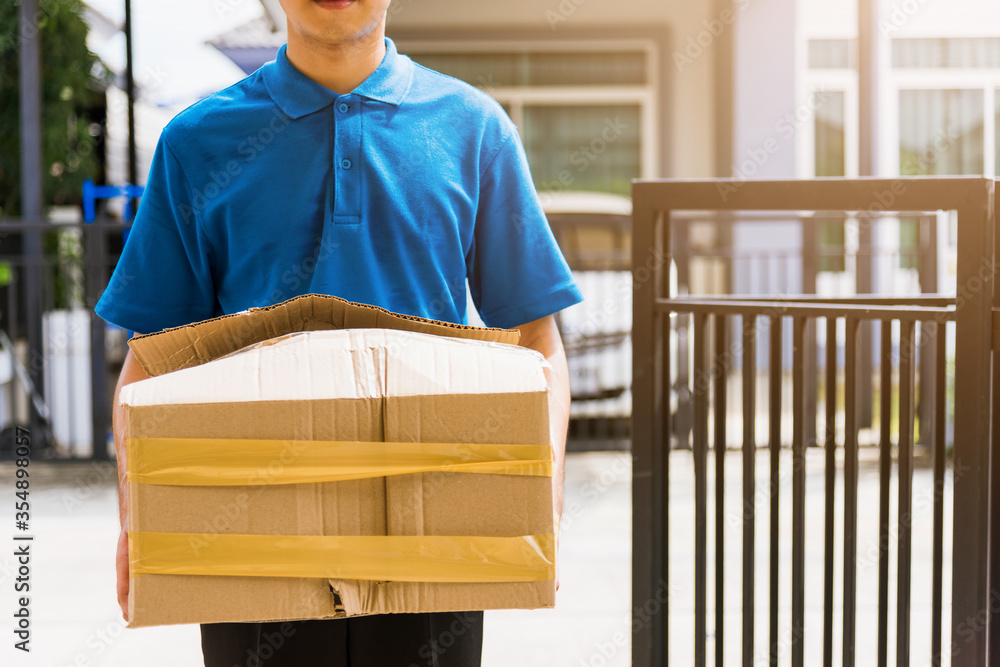 Asian young delivery man in blue uniform he emotional falling courier ...