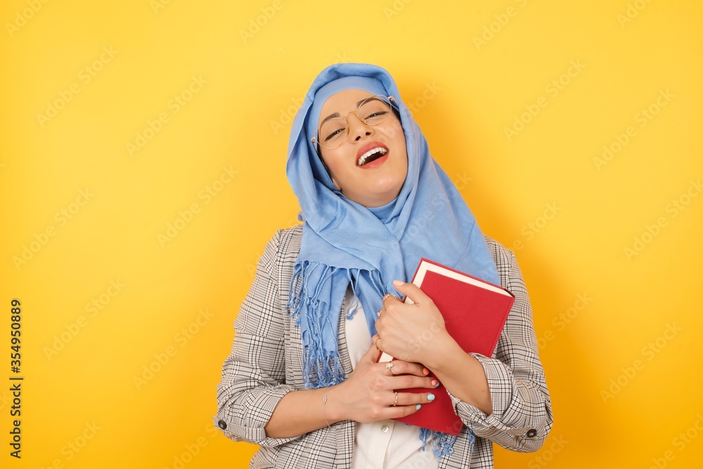 Beautiful smiling young muslim woman wearing hijab with broad smile ...