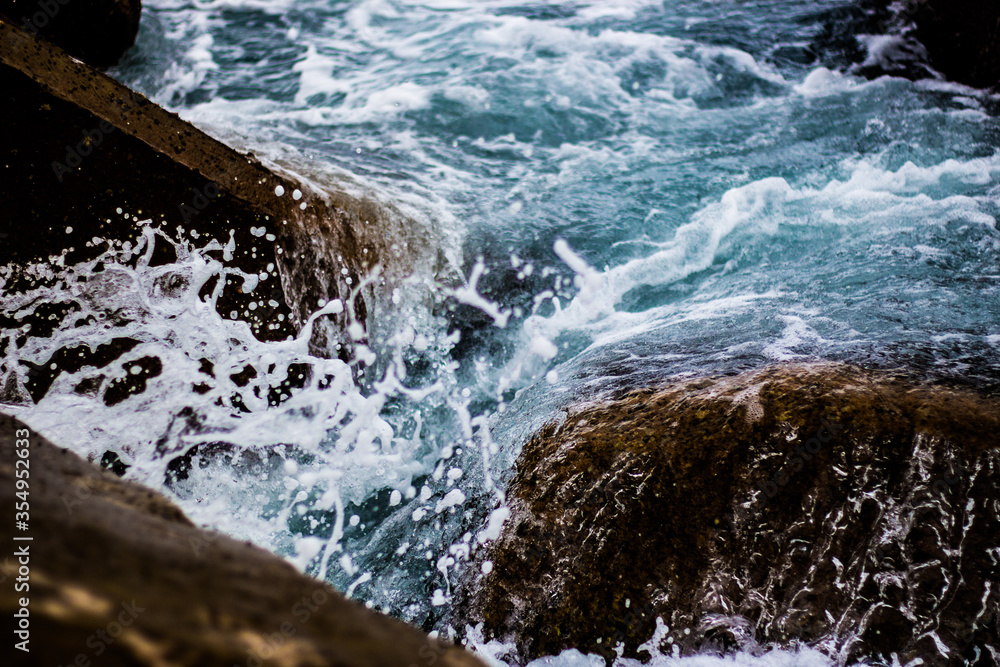 blue water wave splash on the rocks Stock Photo | Adobe Stock
