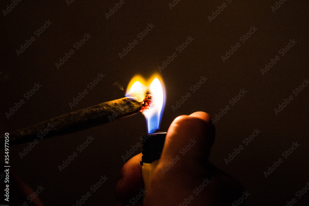hand holding lighter Stock Photo | Adobe Stock