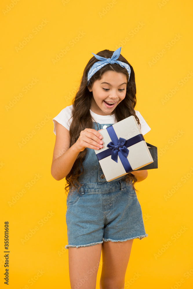 Time to shop. cheerful kid open wrapped box. best resent ever. gift she ...