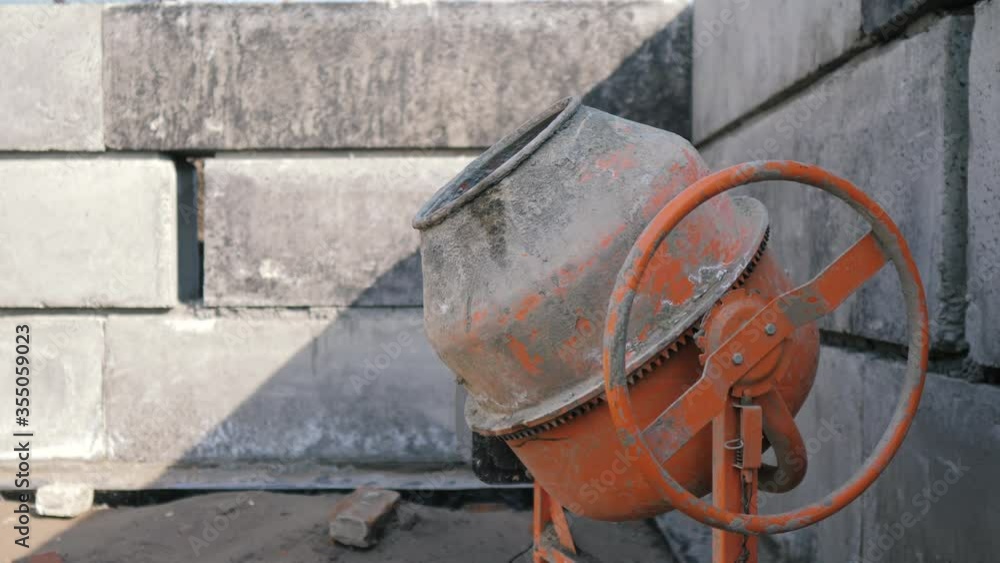 Industrial lifestyle cement mixer machine a construction site. concept ...