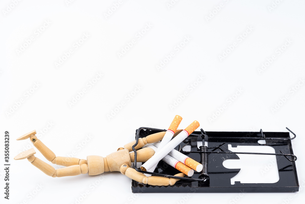 Wooden puppet caught in Mousetrap with cigarettes as bait.No Smoking ...