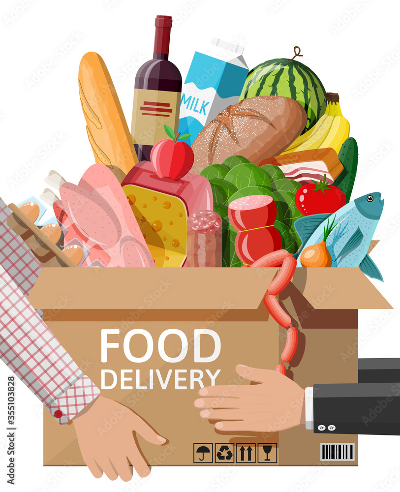 Cardboard box with fresh products in hand. Delivery concept. Grocery ...