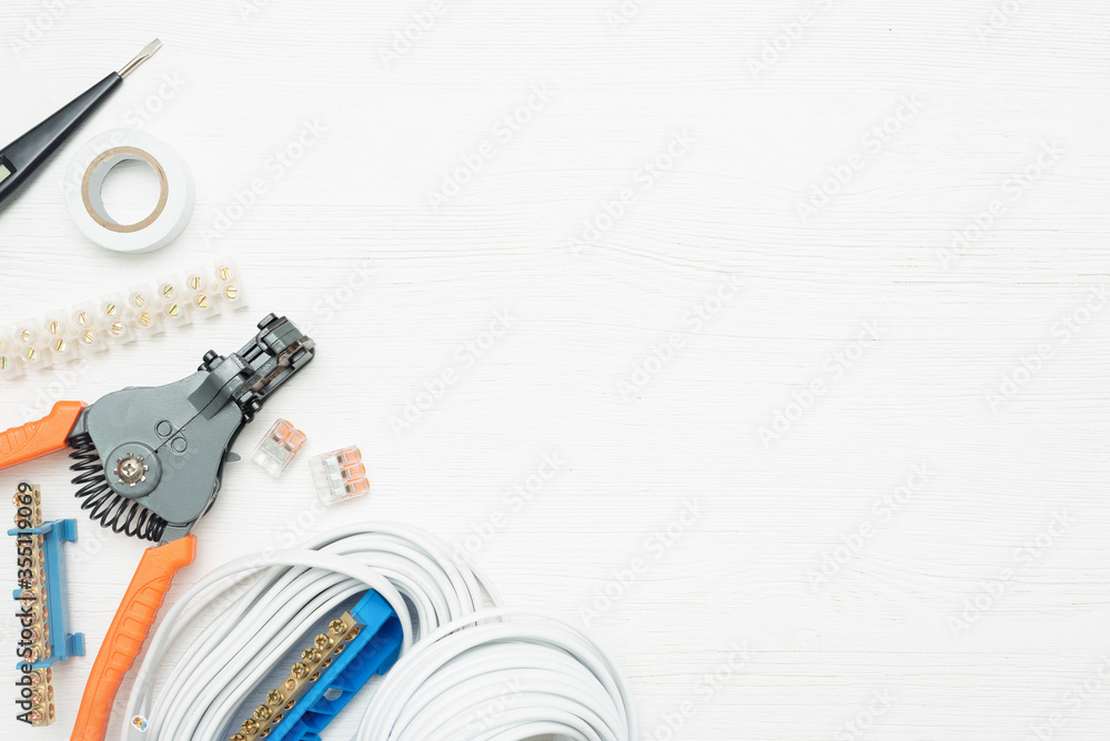 Cable stripper and electrical wiring on the white workbench background ...