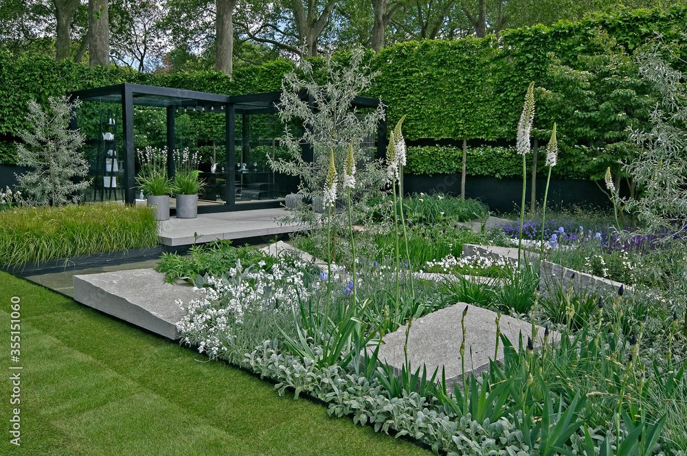 A modern Cool Scandinavian stylish garden design with flowers and ...
