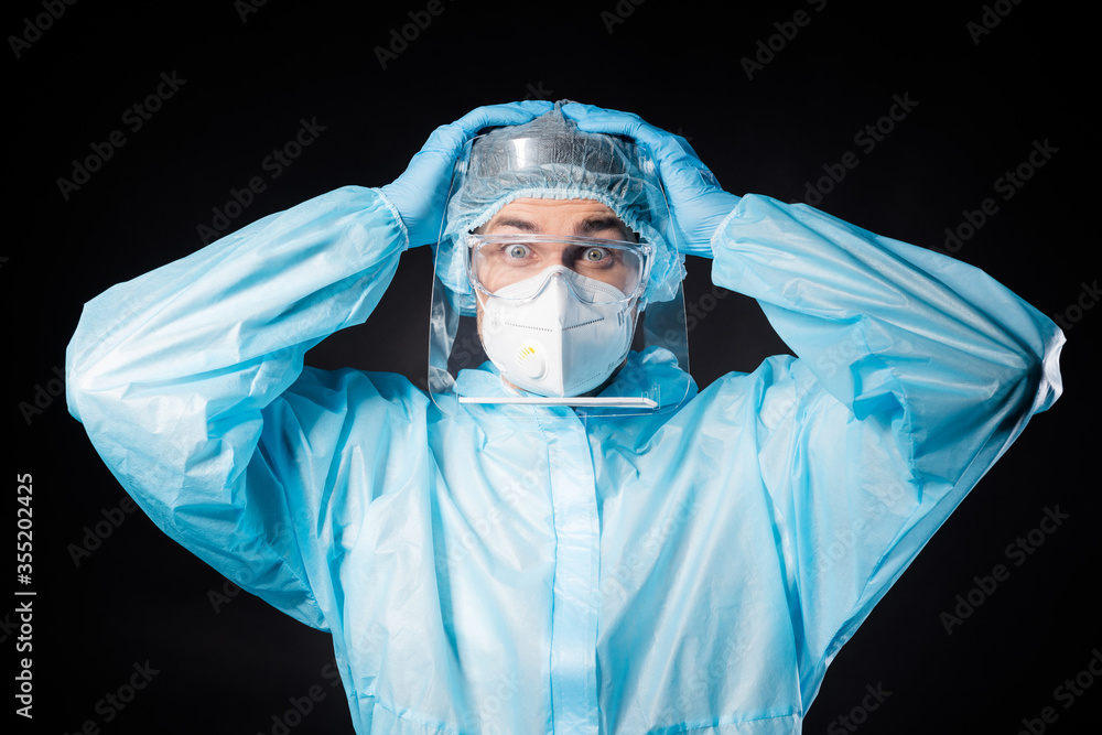 Photo of guy doc virologist eyes fear hold arms on head many sick covid ...