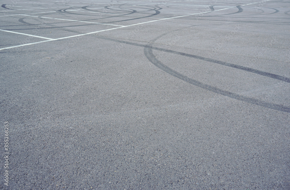 Asphalt texture with white line and tire marks. Smooth asphalt road ...