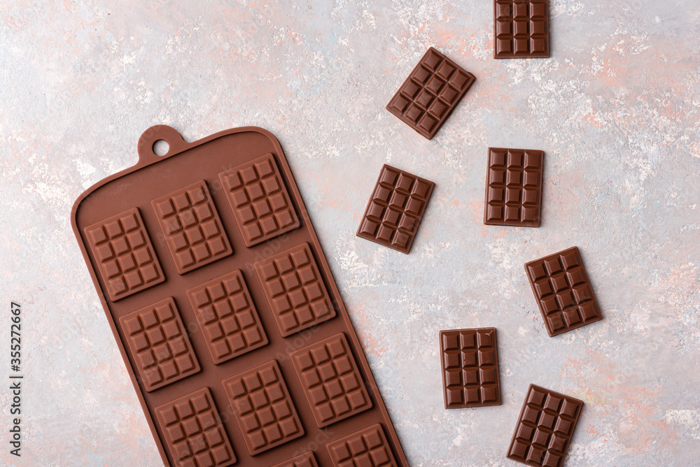 Mini chocolate bars and silicone mold. Stock Photo | Adobe Stock