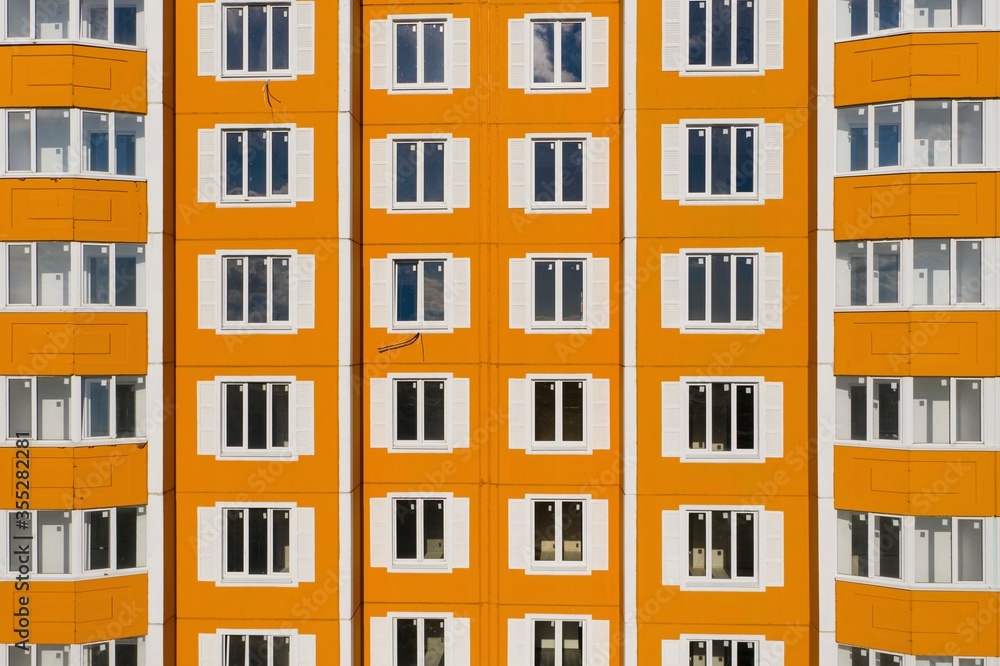 Aerial view of a tall residential apartment building with many windows ...