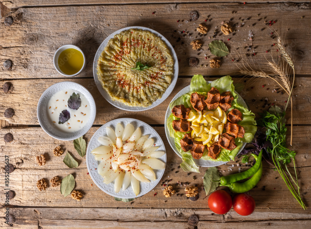 Food appetizers. raw meatballs, cig kofte, grilled onions, grilled ...